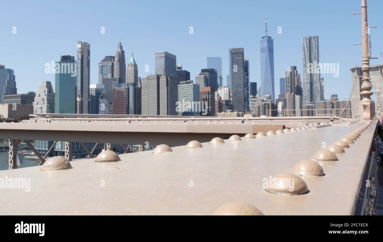 Brooklyn Bridge to Manhattan downtown. New York City skyline, financial ...