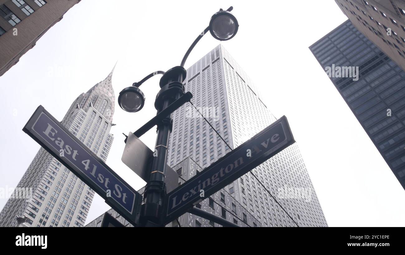 New York City crossroad, street intersection road sign on post ...