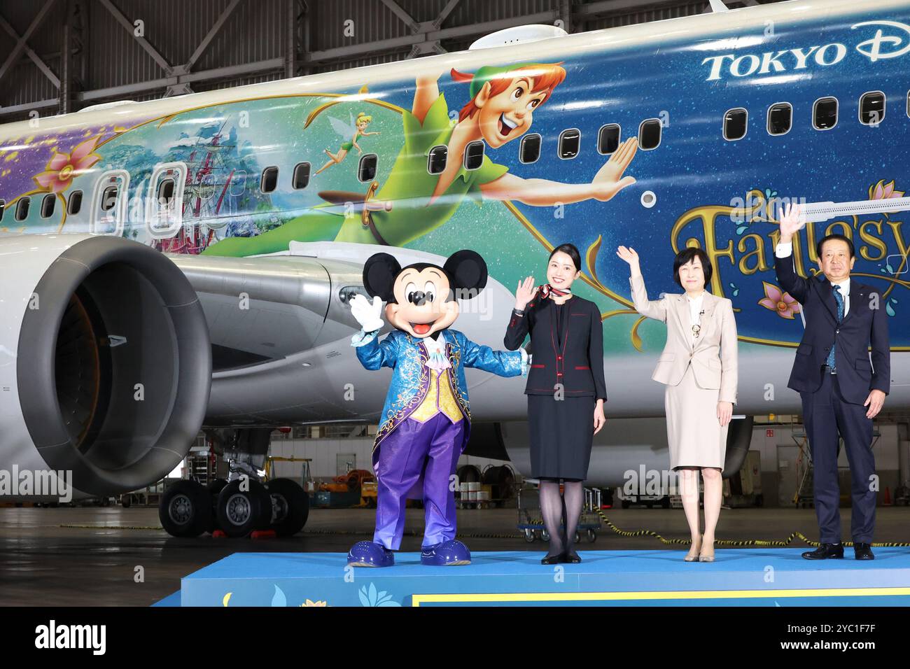 Tokyo, Japan. 21st Oct, 2024. (L-R) Mickey Mouse, JAL cabin attendant ...