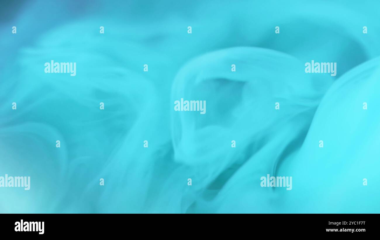 Color smoke texture. Ink water splash. Defocused bright cyan blue ...