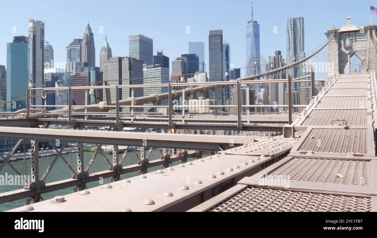 Brooklyn Bridge to Manhattan downtown. New York City skyline, financial ...