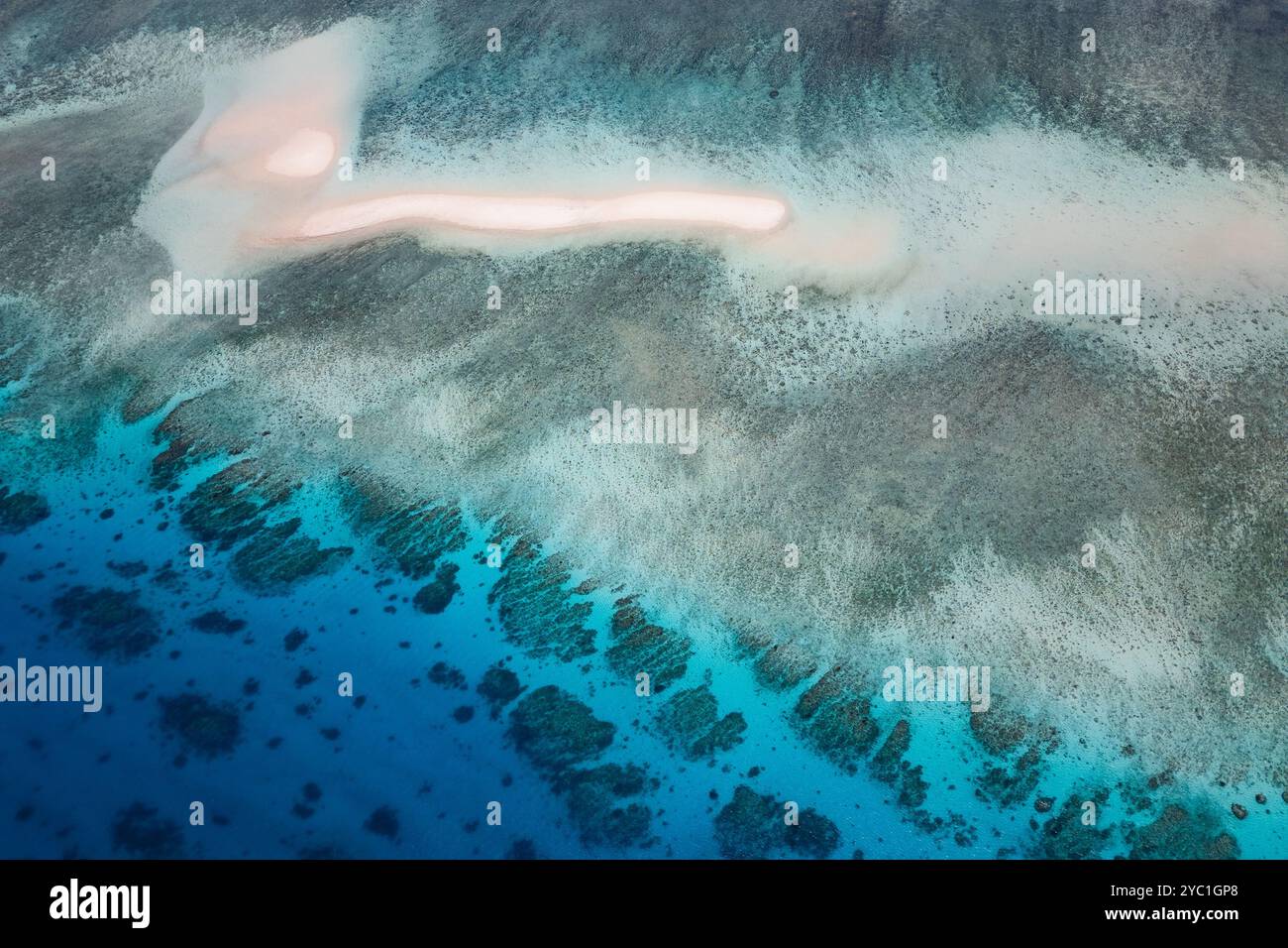 Aerial view of Mayotte’s lagoon reef, showcasing turquoise waters and ...