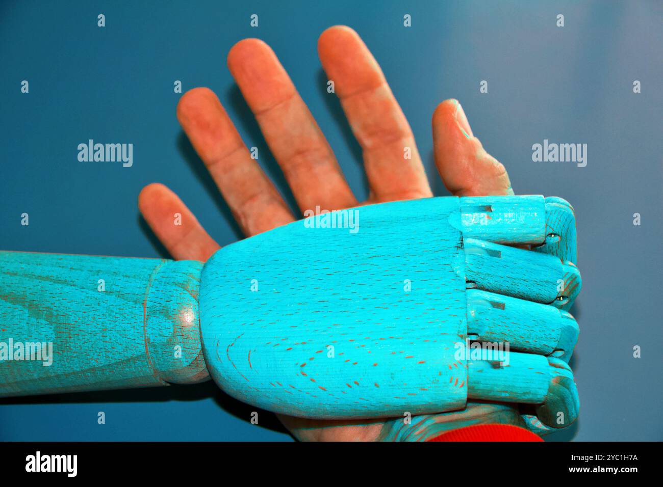 Robot hand winning against human hand. Arm wrestle Stock Photo - Alamy