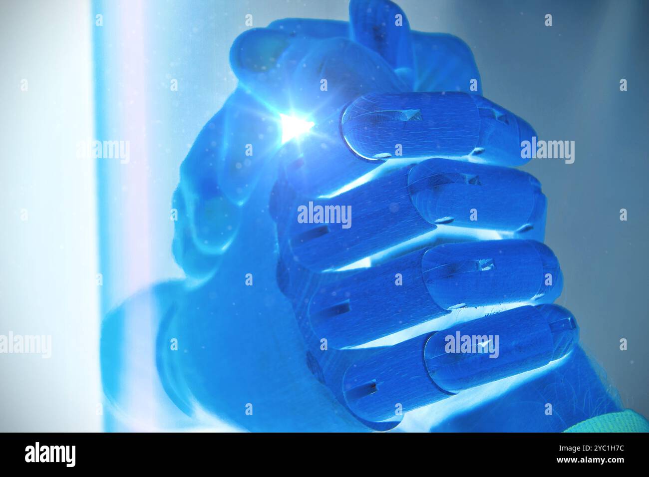 Conceptual photo representing competition Human and robot arm wrestling ...