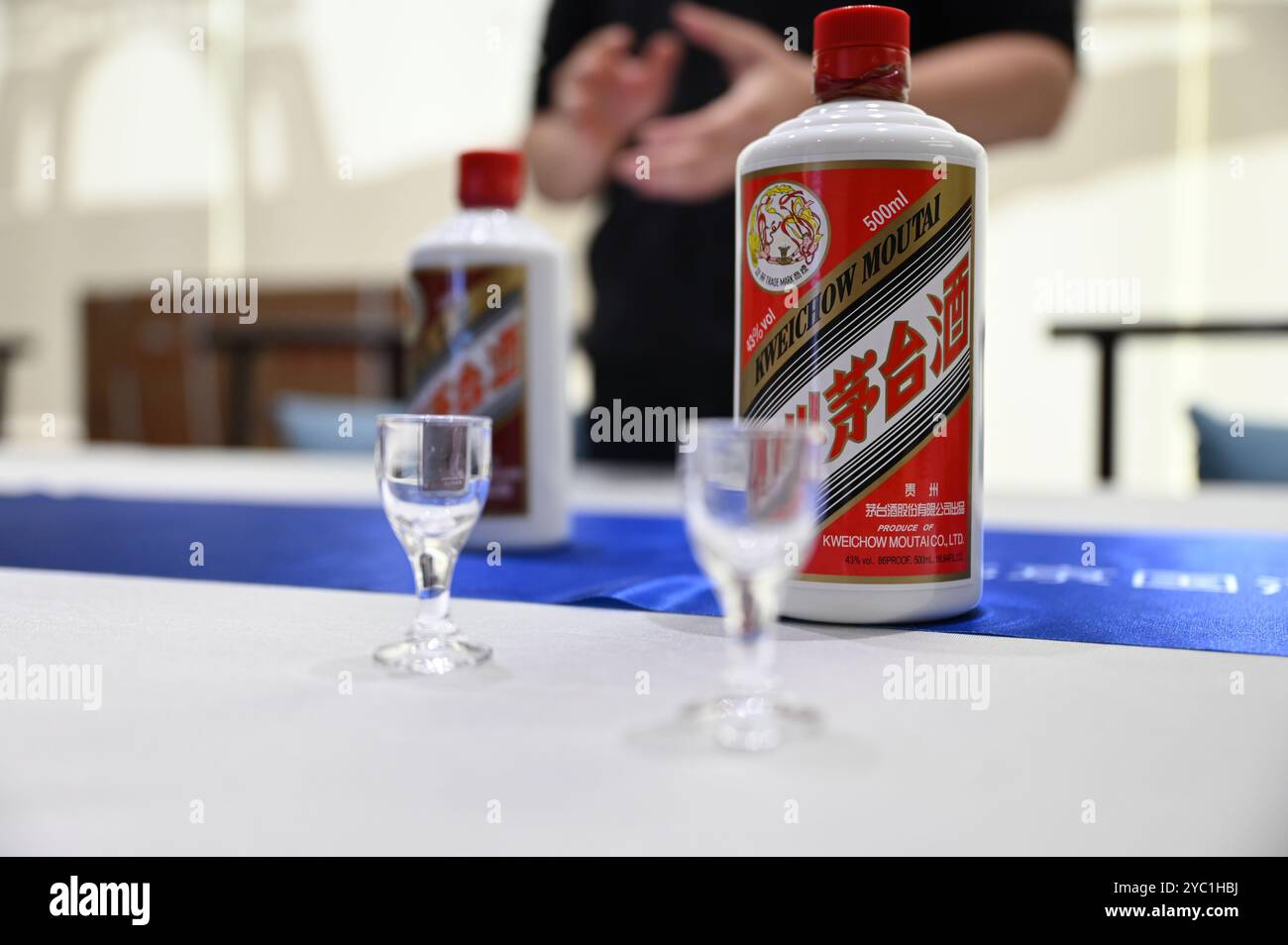 Peking, China. 29th Sep, 2024. Two liquor glasses and bottles with the ...