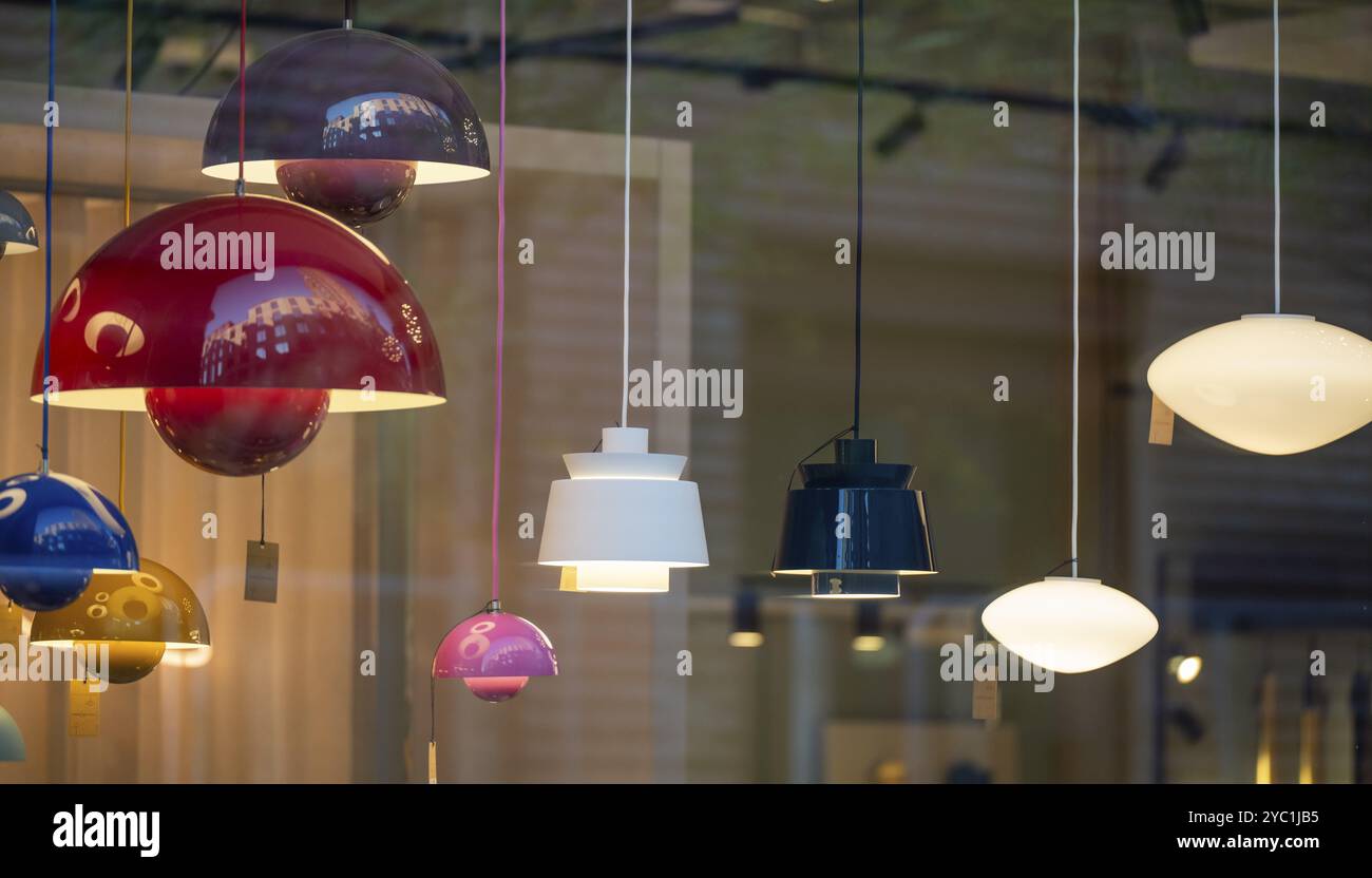 Coloured and white lamps in Nordic design in a shop window, Valby ...