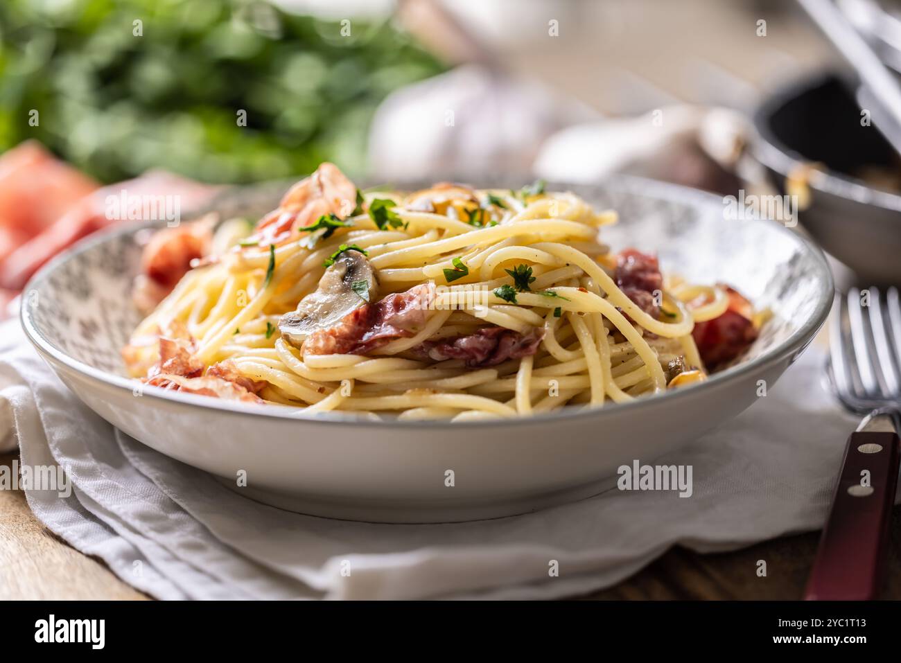 Traditional Italian spaghetti with prosciutto, mushrooms and parmesan ...