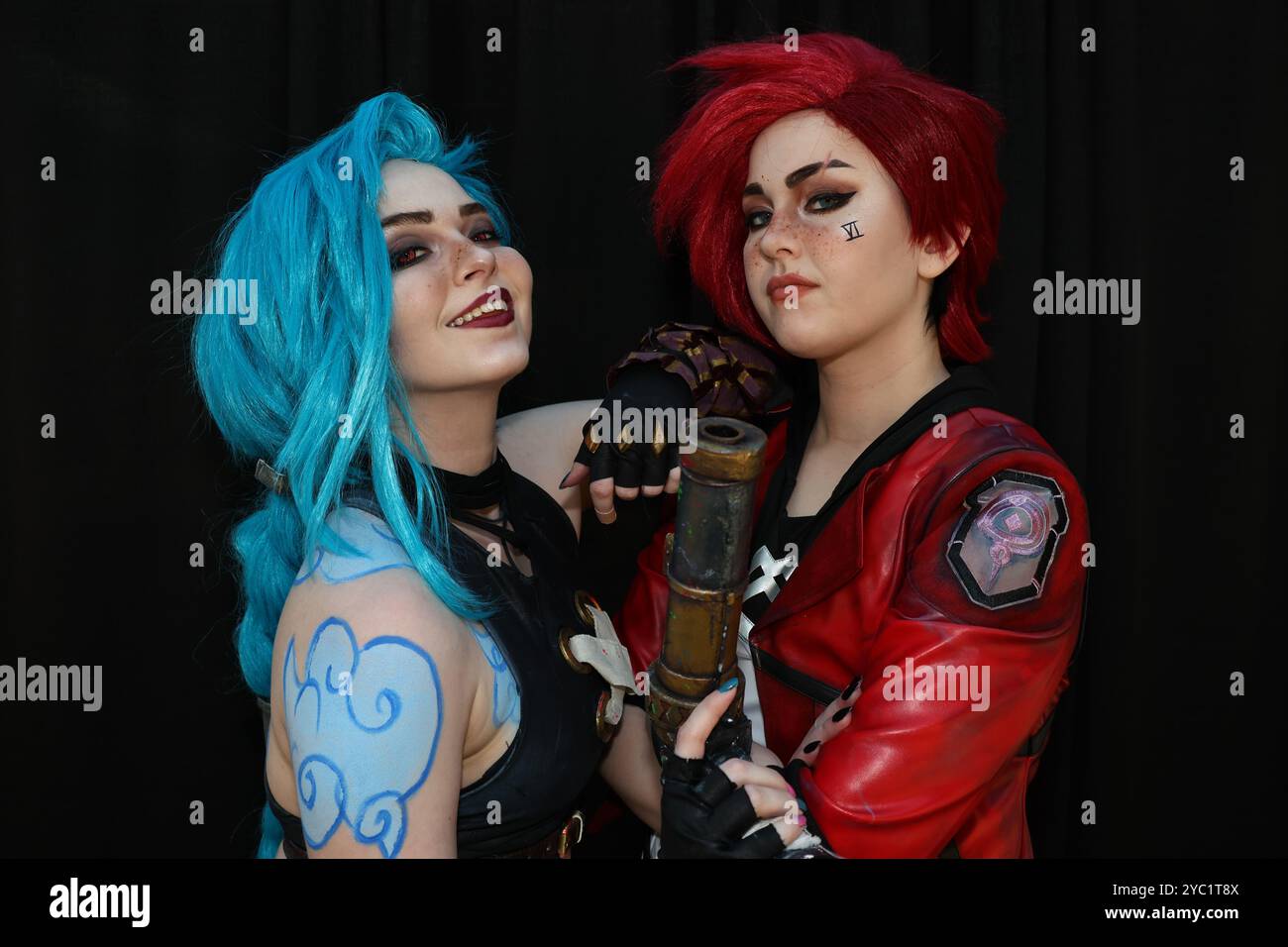 Cosplayers Stella and Lex from New York portray Jinx and Vi from Arcane ...