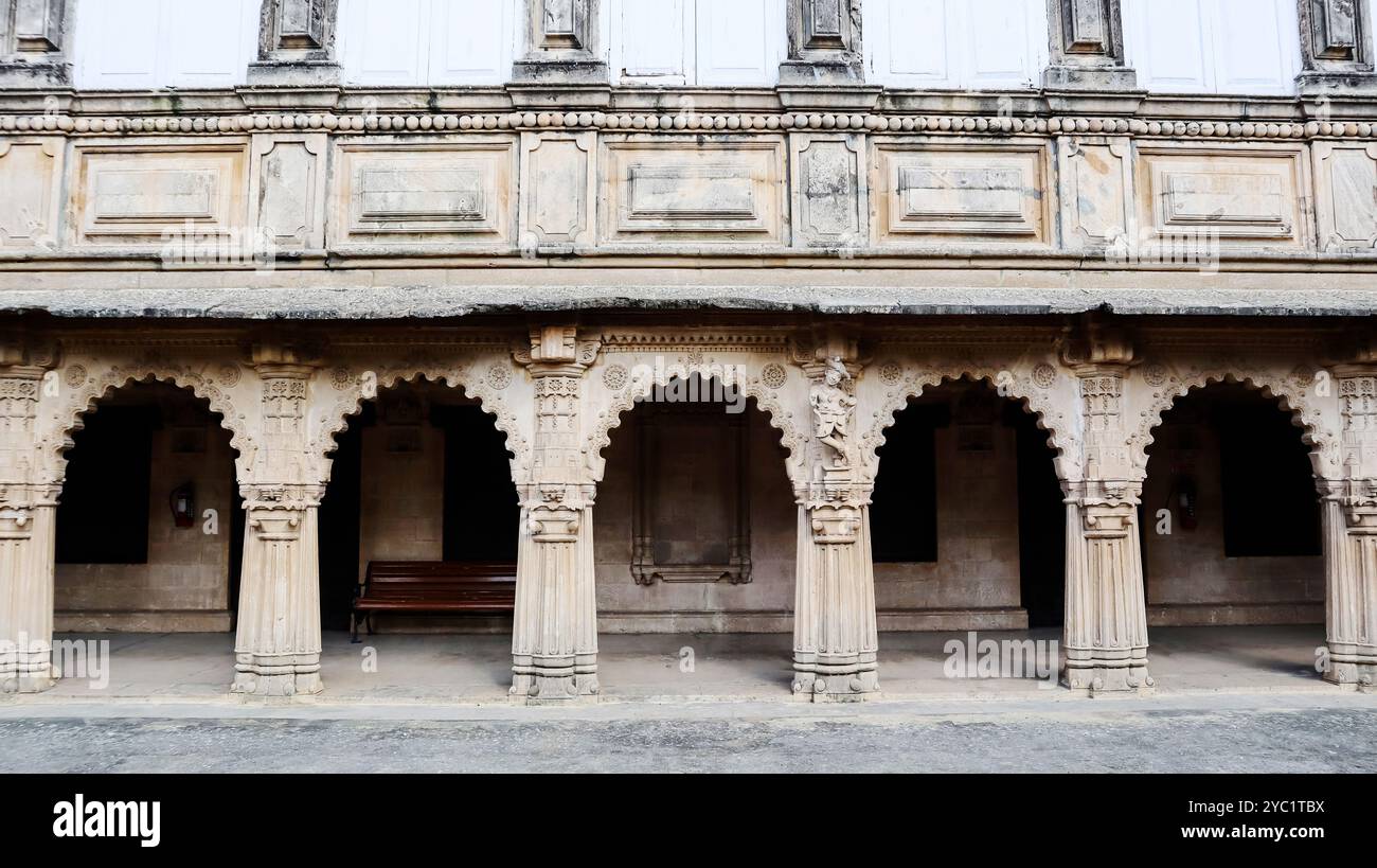 View of the carved arches of the courtyard of Naulakha Palace, Gondal ...