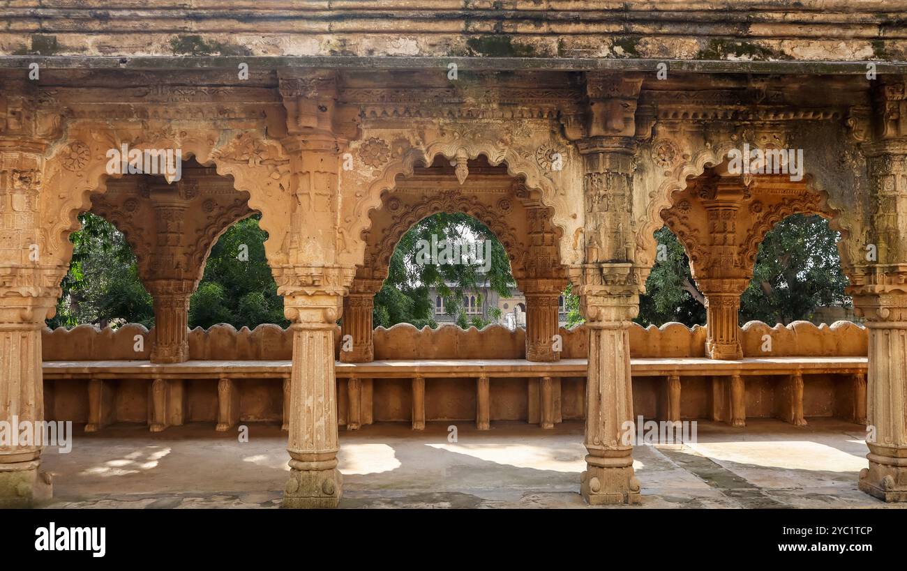 View of the carved arches of the courtyard of Naulakha Palace, Gondal ...