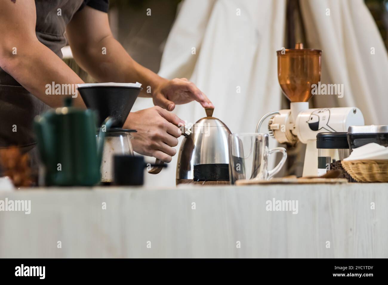 Professional coffee maker - Barista using coffee siphon brewing hot ... Professional coffee maker - Barista using coffee siphon brewing hot ...