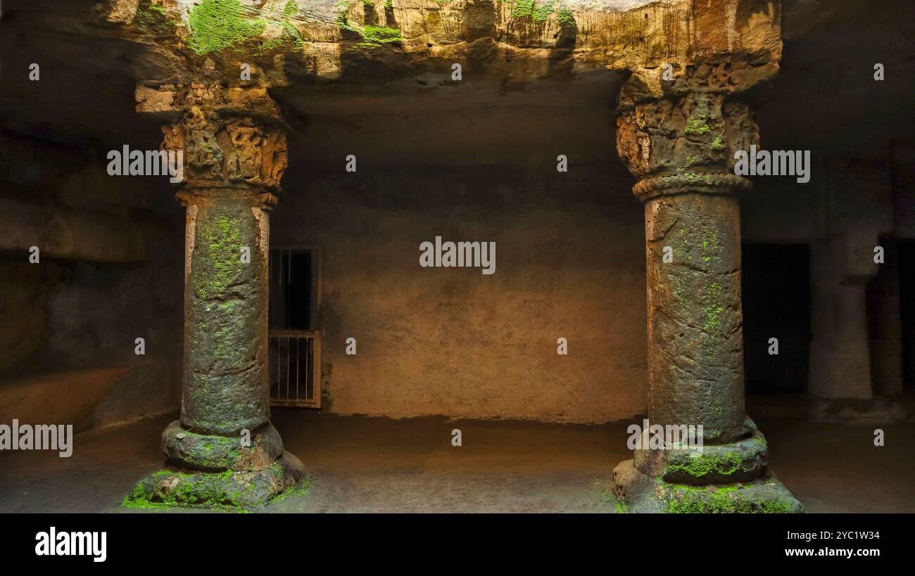 Ancient ruined carved pillars of a Buddhist cave inside Uparkot Fort ...