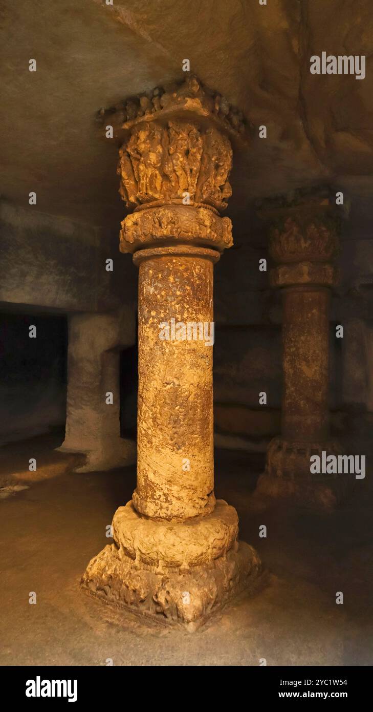Ancient ruined carved pillars of a Buddhist cave inside Uparkot Fort ...