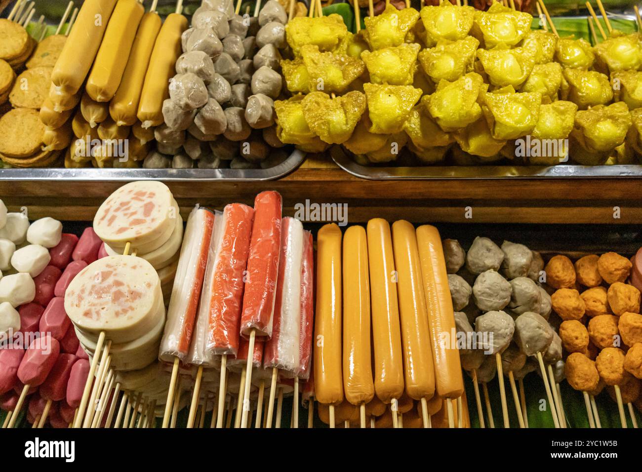 Traditional Asian meat satay street food cooking outdoor at night ...
