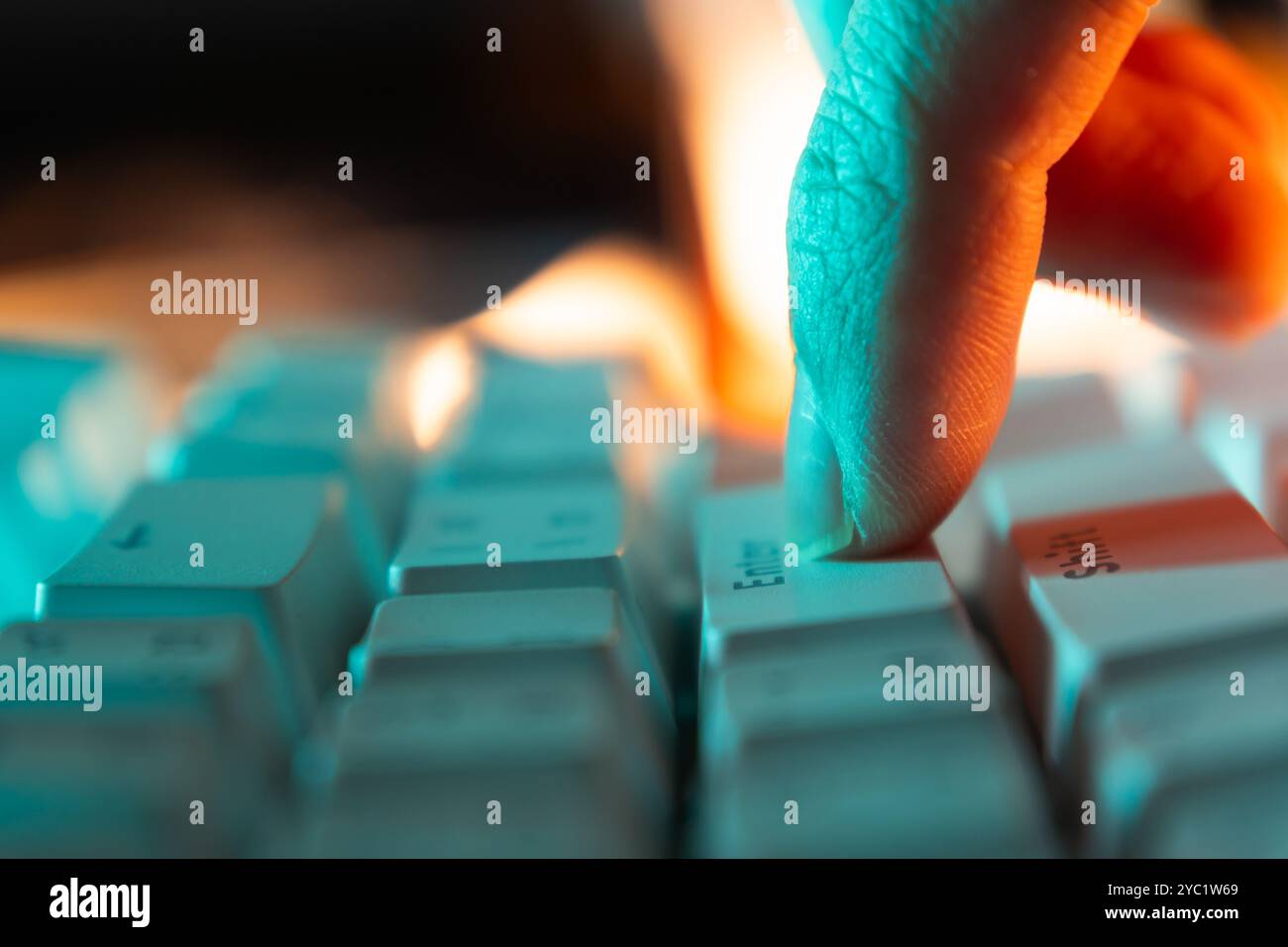 Press enter button on a keyboard with orange and teal light Stock Photo ...