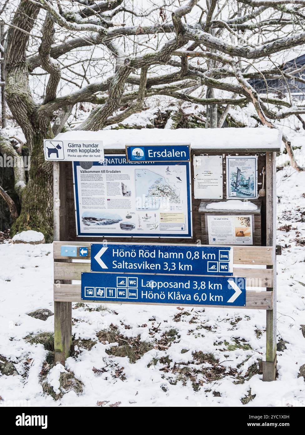 An informative board displaying maps and trail distances at the ...