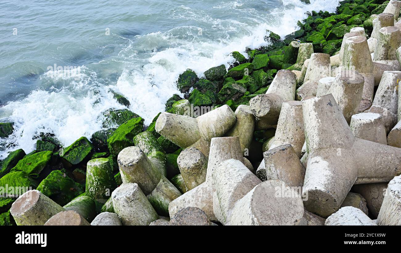 Coast wave breaker stones at Porbandar seaside, Porbandar, Gujarat ...