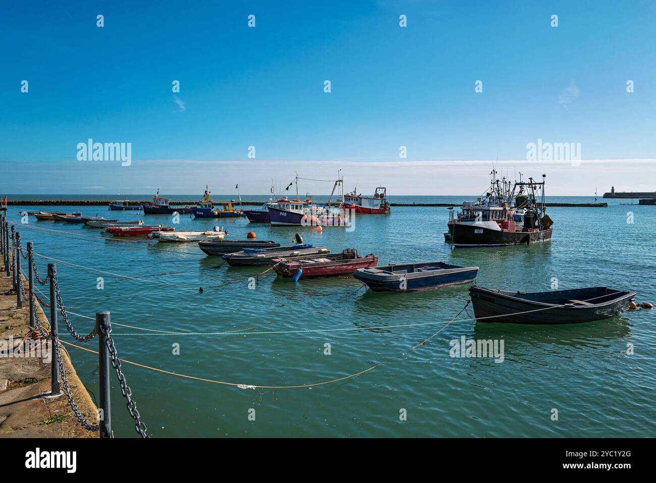 A view acrossFolkestone harbour showing fishing boats and the harbour ...