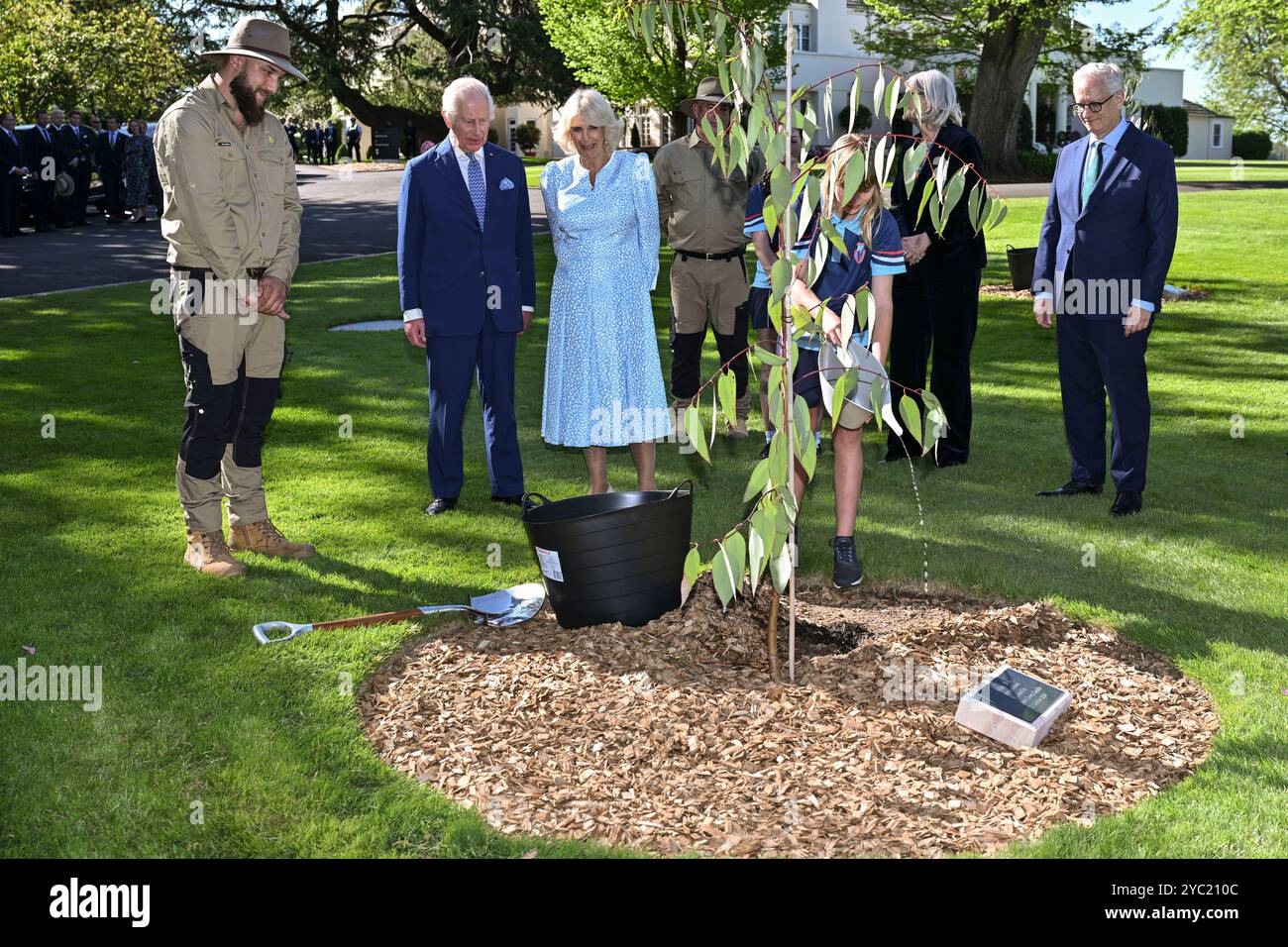 Britain's King Charles III and Queen Camilla take part in a tree planting ceremony at Government ...