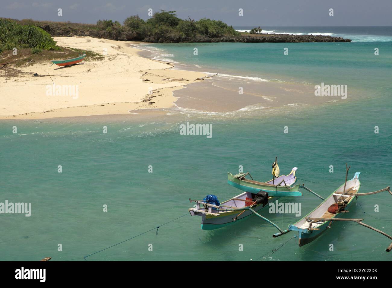 Fishing boats on sea water on a lagoon-like seascape in the fishing ...