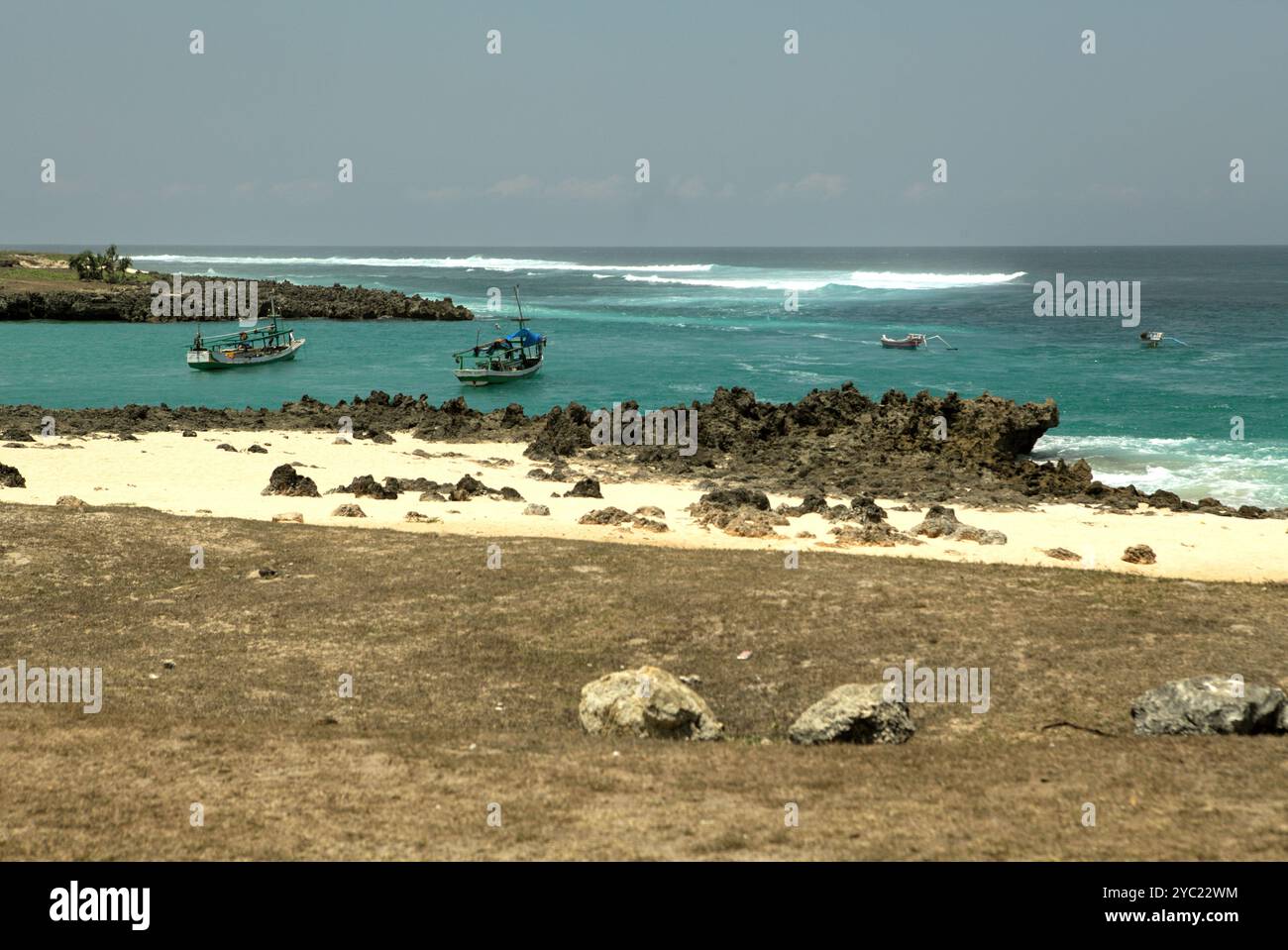 Fishing boats on the coastal water of Sumba Island, facing the Indian ...