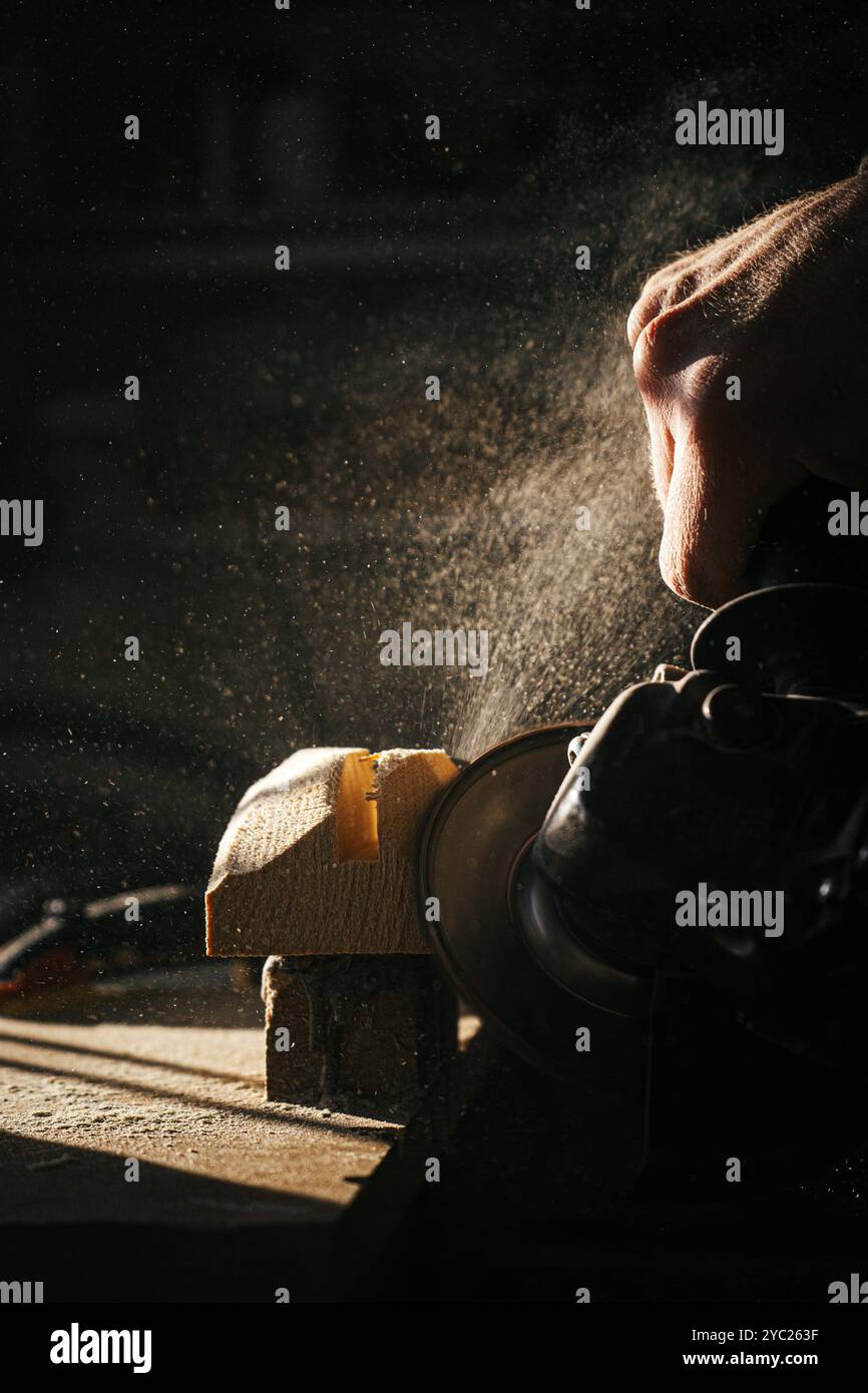 Woodworking process with sawdust flying Stock Photo - Alamy