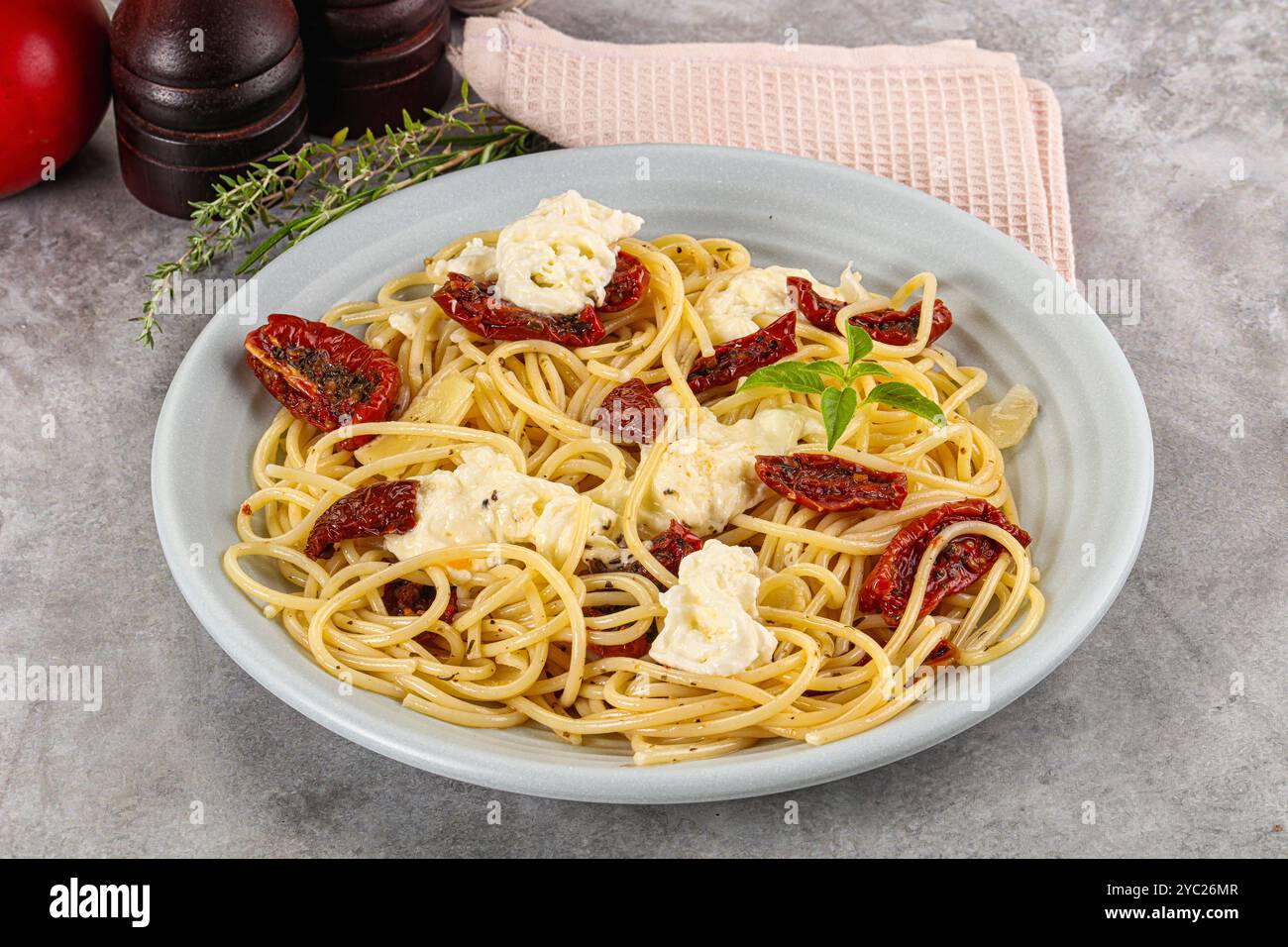 Italian pasta spaghetti with stracciatella and tomato Stock Photo - Alamy