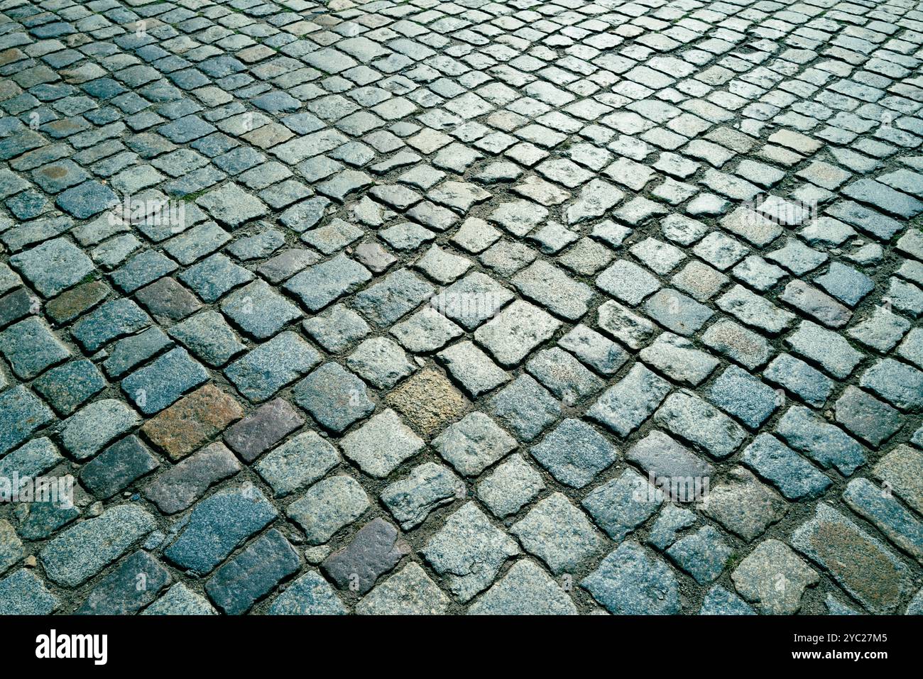Background of bricks road. Background with bricks road. Stone cladding ...