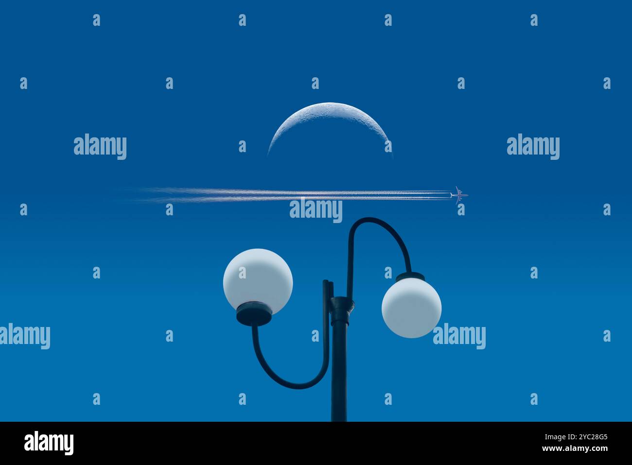 Street light passenger jet aircraft with vapor trail condensation ...