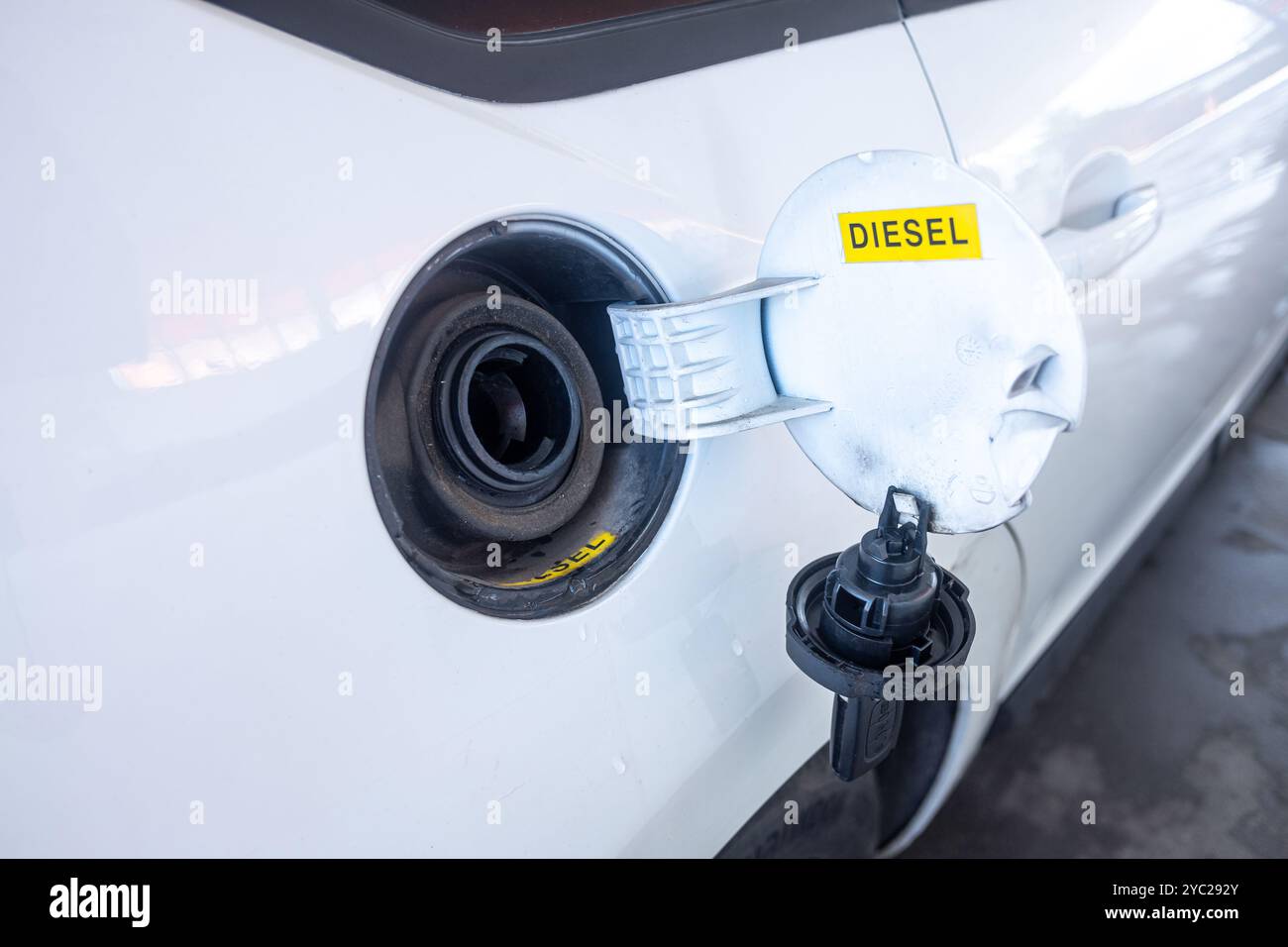 open tank cap of a white diesel vehicle Stock Photo - Alamy