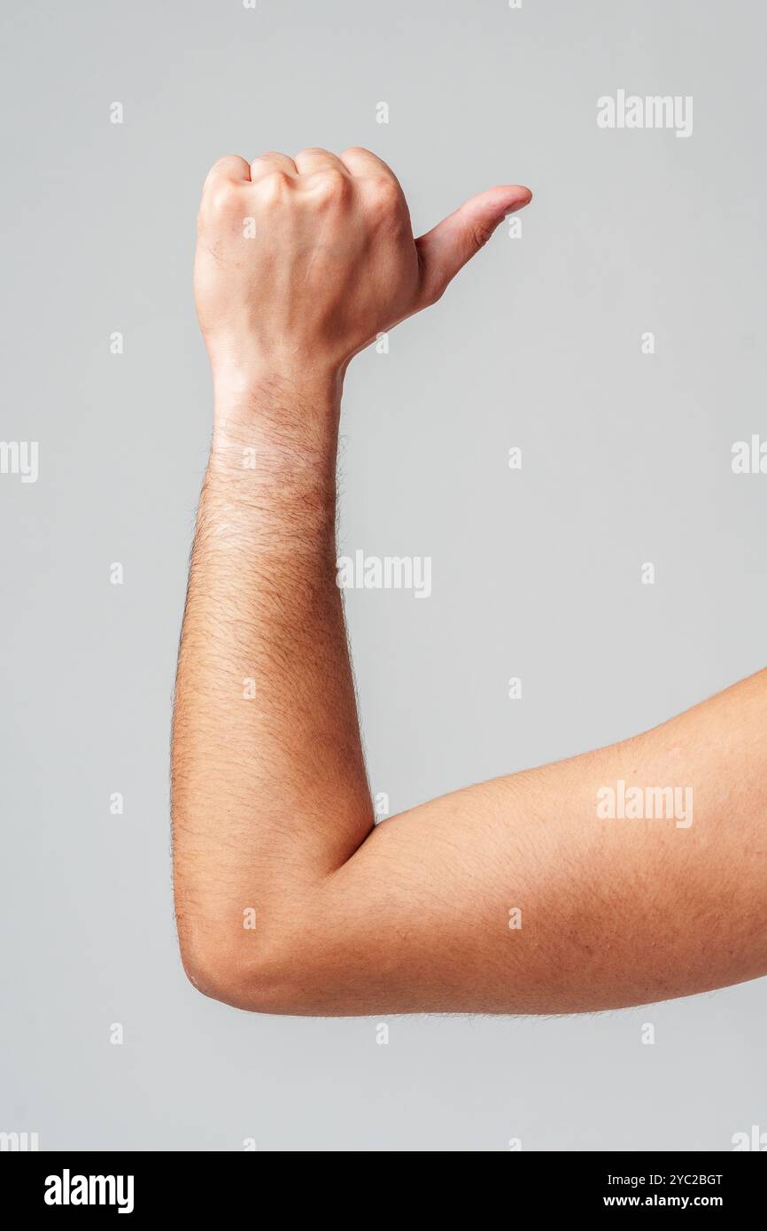 A person hand gesture against a neutral background Stock Photo - Alamy