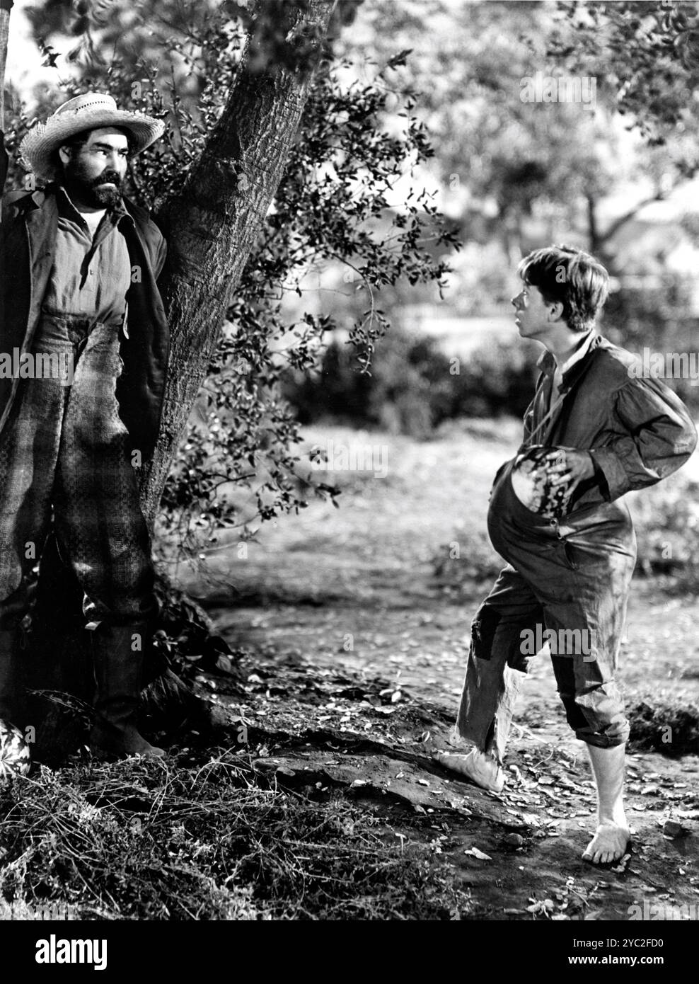 VICTOR KILIAN as his drunken father and MICKEY ROONEY as Huck Finn in ...
