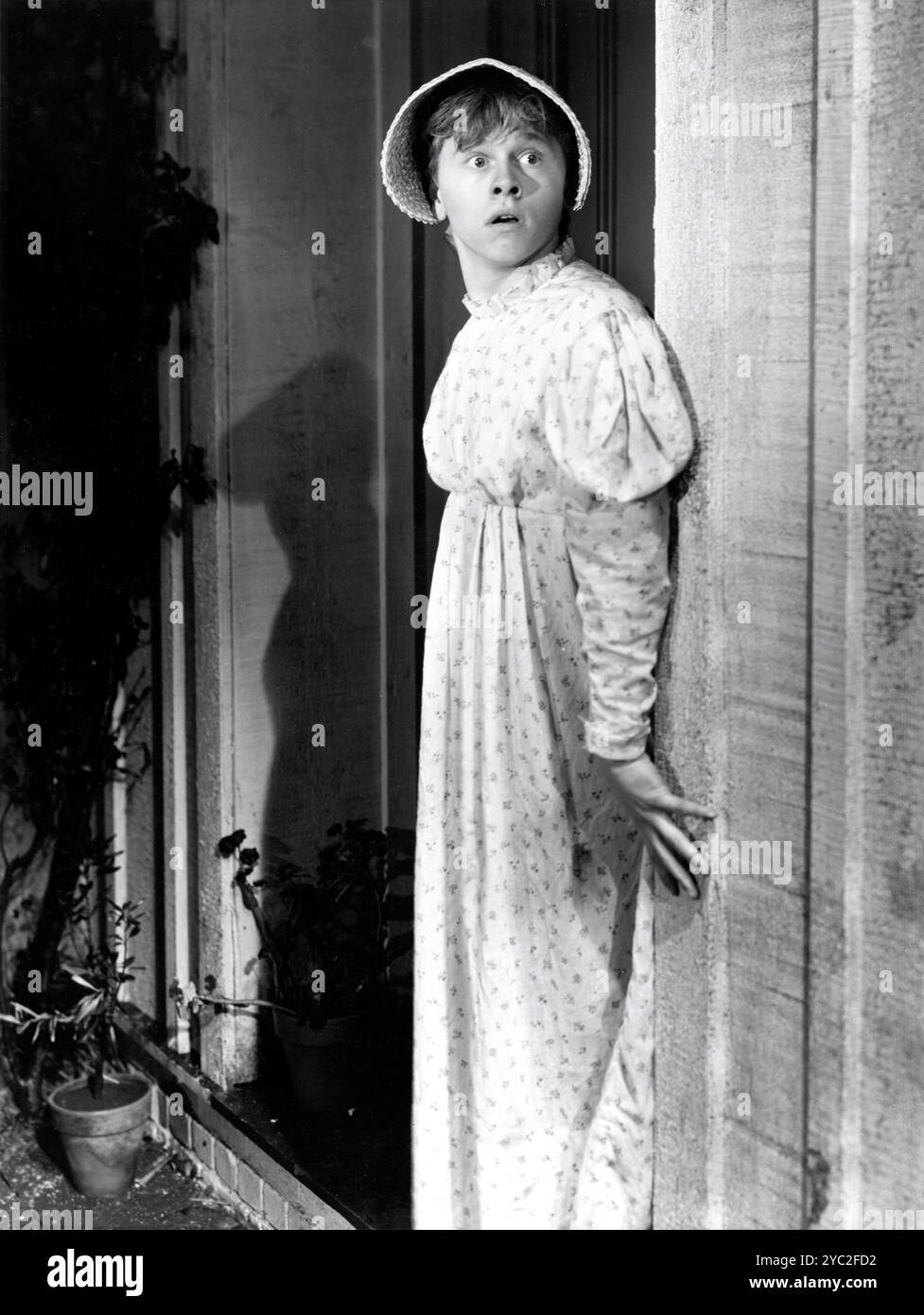 MICKEY ROONEY as Huck Finn disguised as a girl to avoid a lynch mob in ...