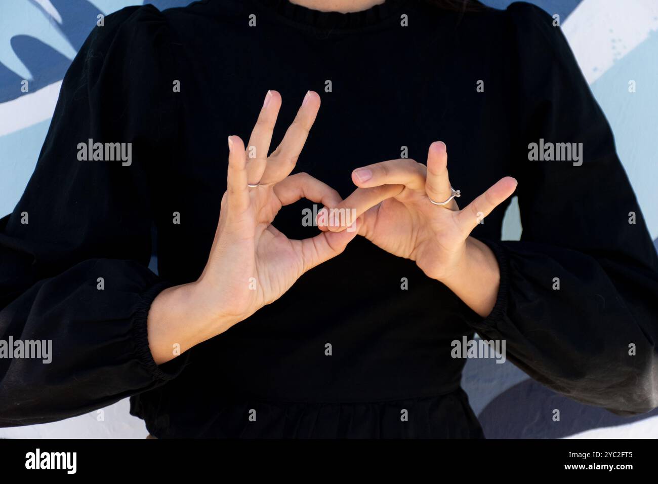 Closeup of hands signing 'connect' in ASL Stock Photo - Alamy
