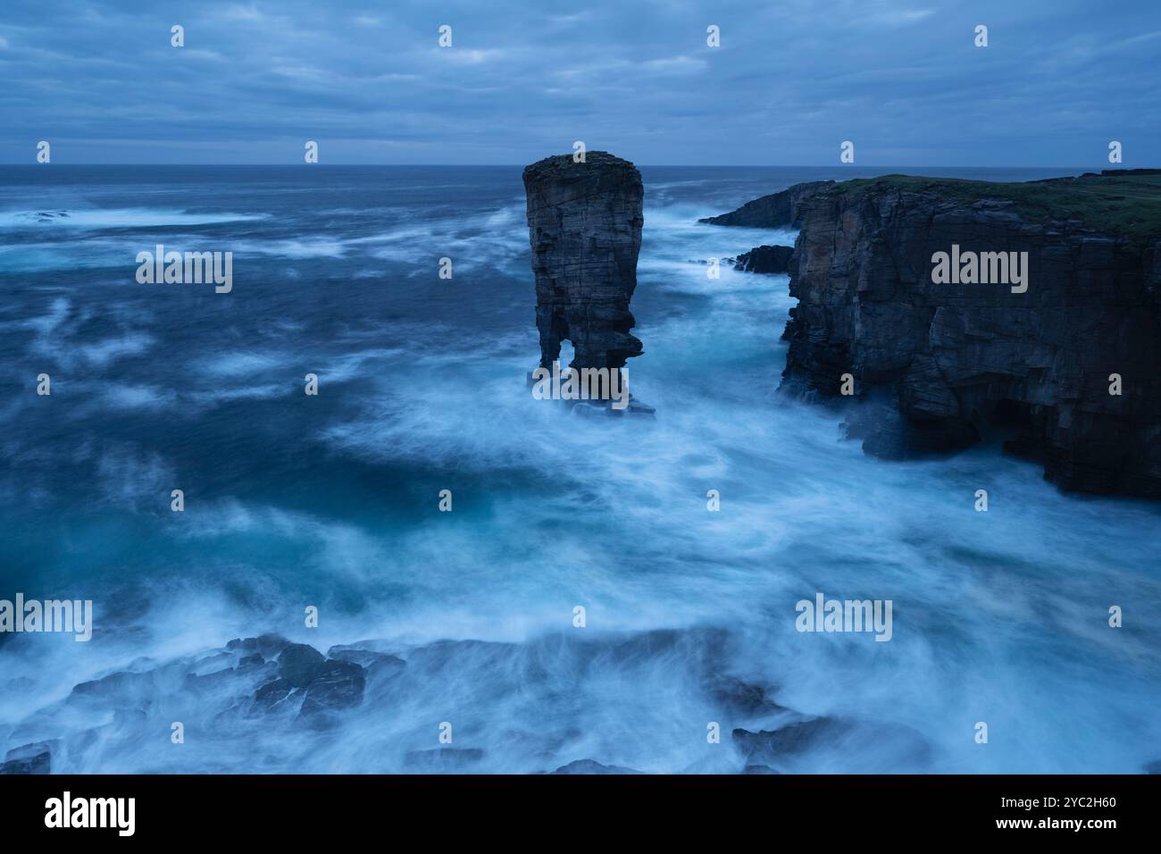 Waves flow around Yesnaby Castle sea stack, Orkney, Scotland Stock ...