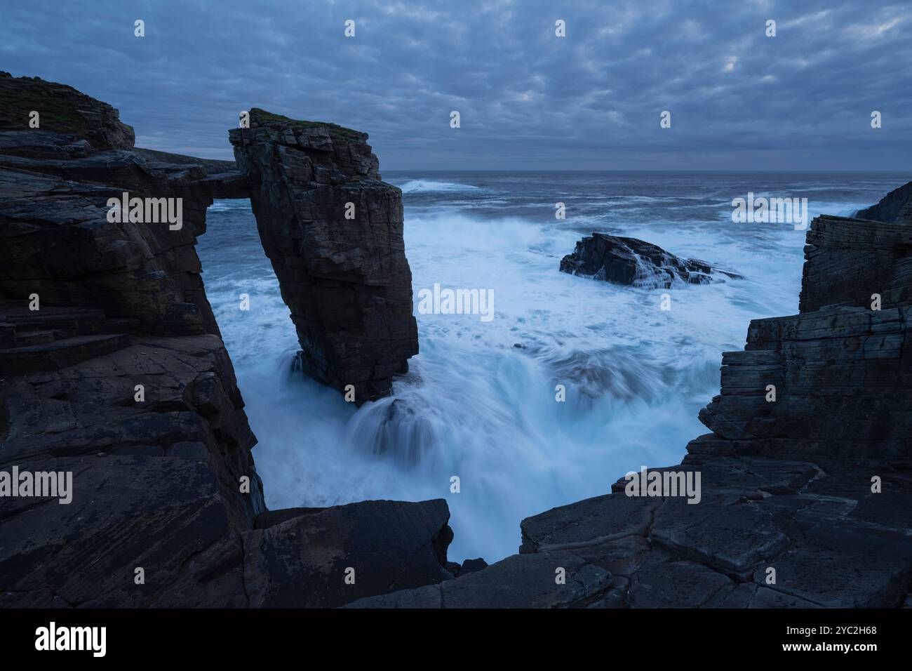 Waves flow around sea stack at Yesnaby, Orkney, Scotland Stock Photo ...