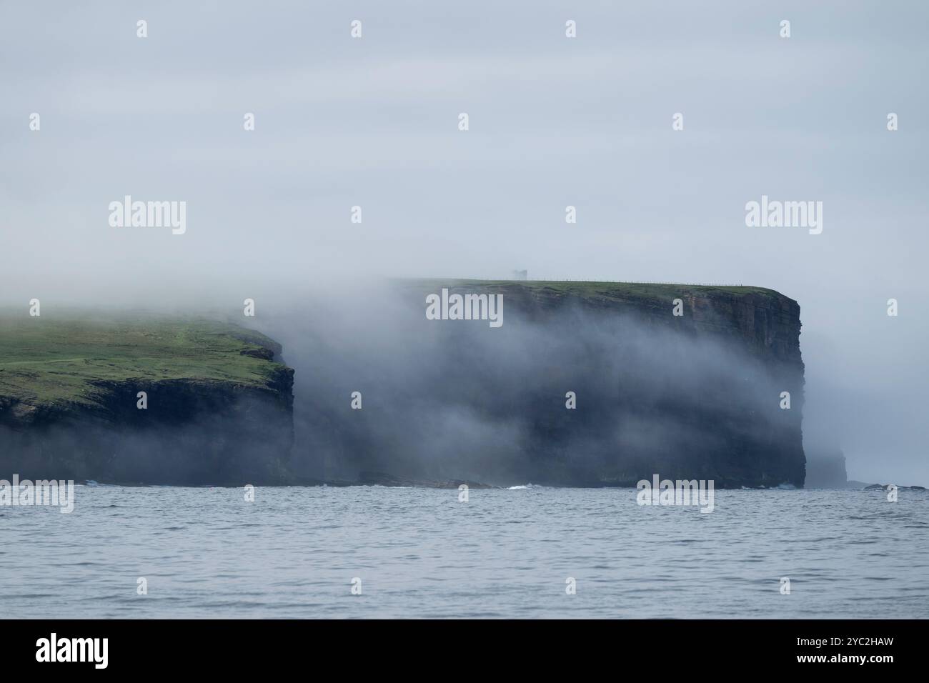 Misty clouds conceal cliffs of Marwick head, Orkney, Scotland Stock ...