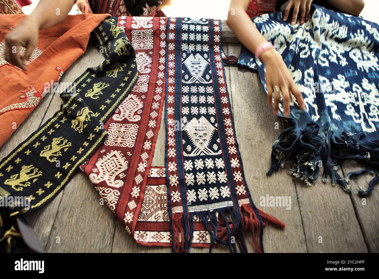 Women selling woven textile products as a traditional source of ...