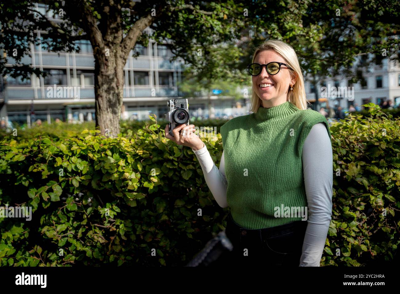 Female Traveler In Copenhagen Taking Pictures Stock Photo - Alamy