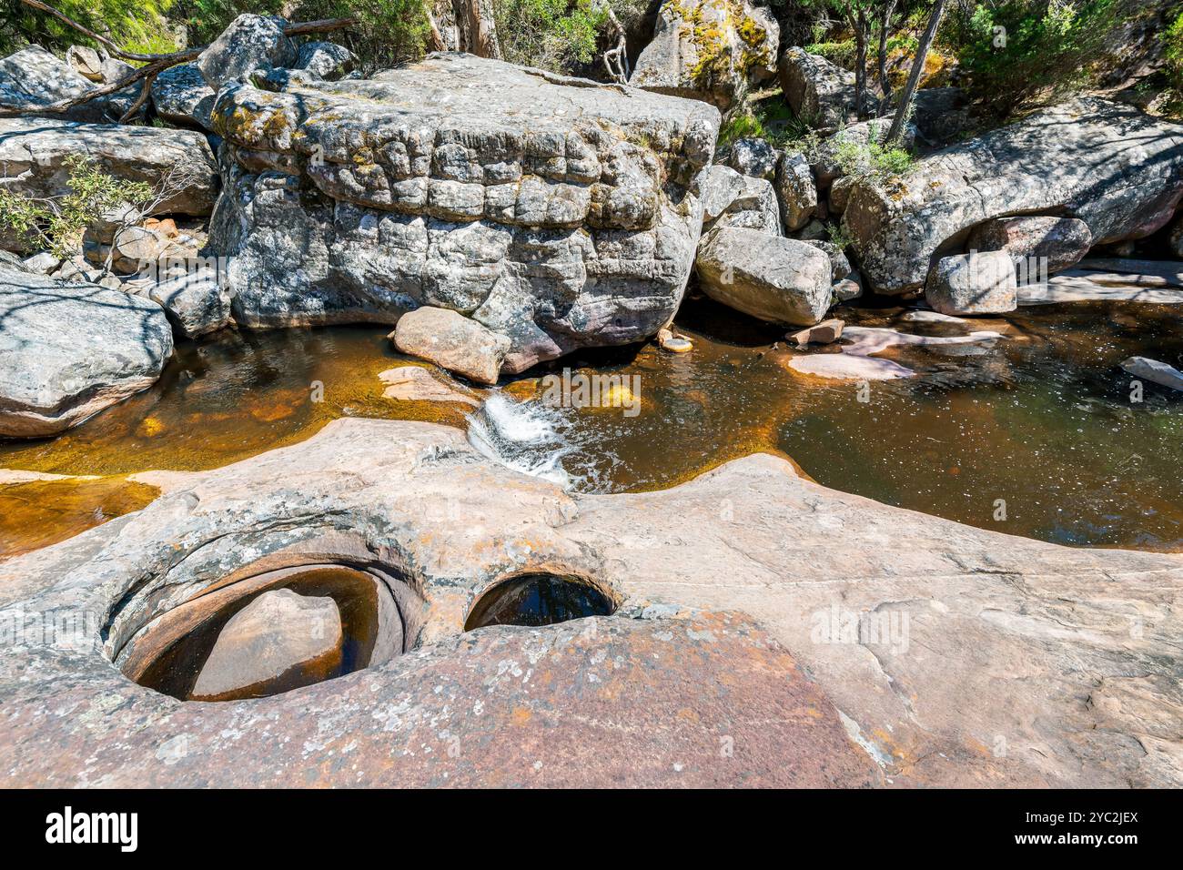 Venus Baths freshwater rock pools with slides in sandstones on a day ...