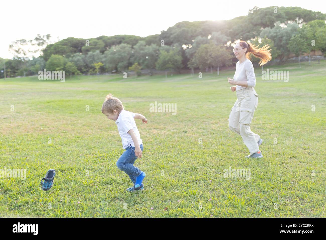 Family playing tag game in hi-res stock photography and images - Alamy
