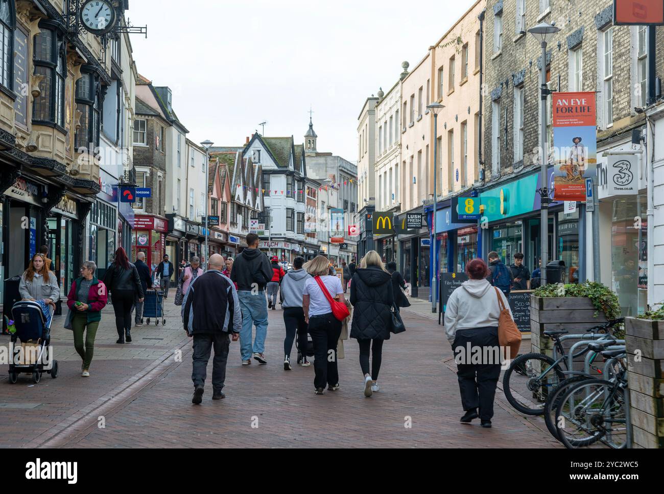 People shoppers walking along pedestrianised town centre street, Tavern ...