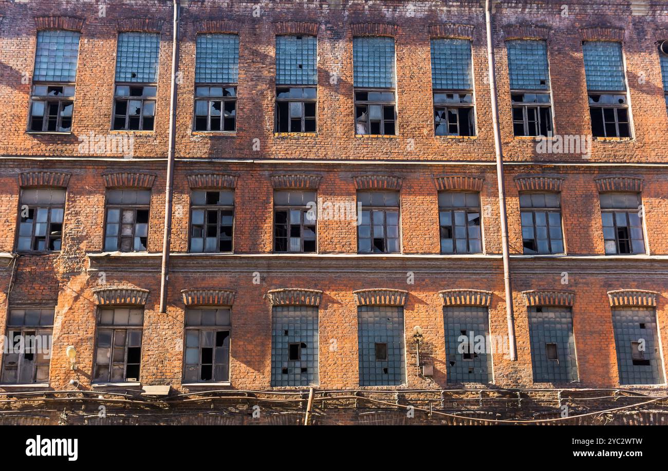 industrial background, facade of abandoned vintage factory building ...