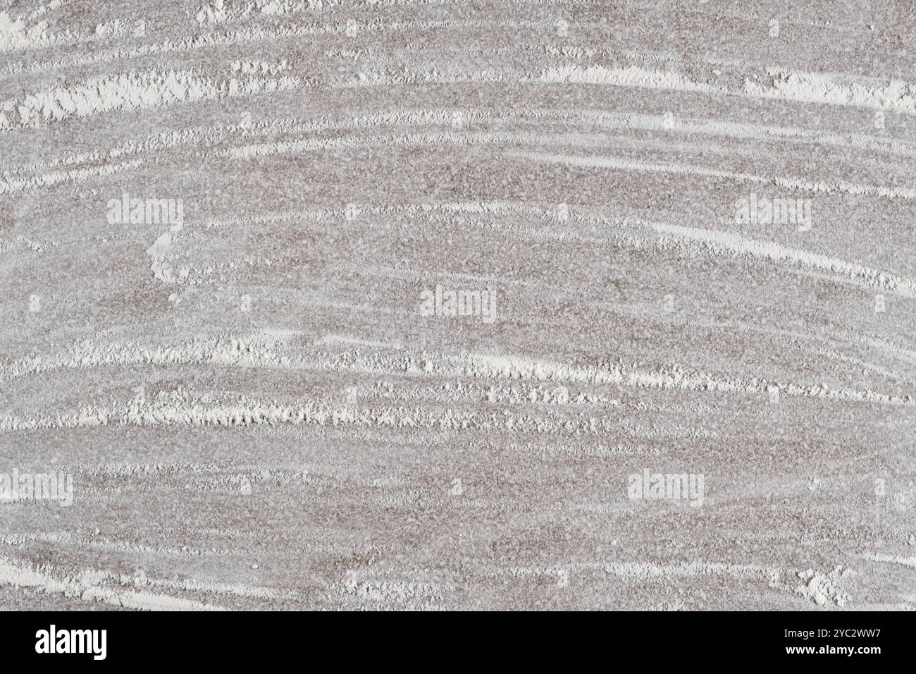 Grey cooking background of spilled wheat flour on stone background, top ...