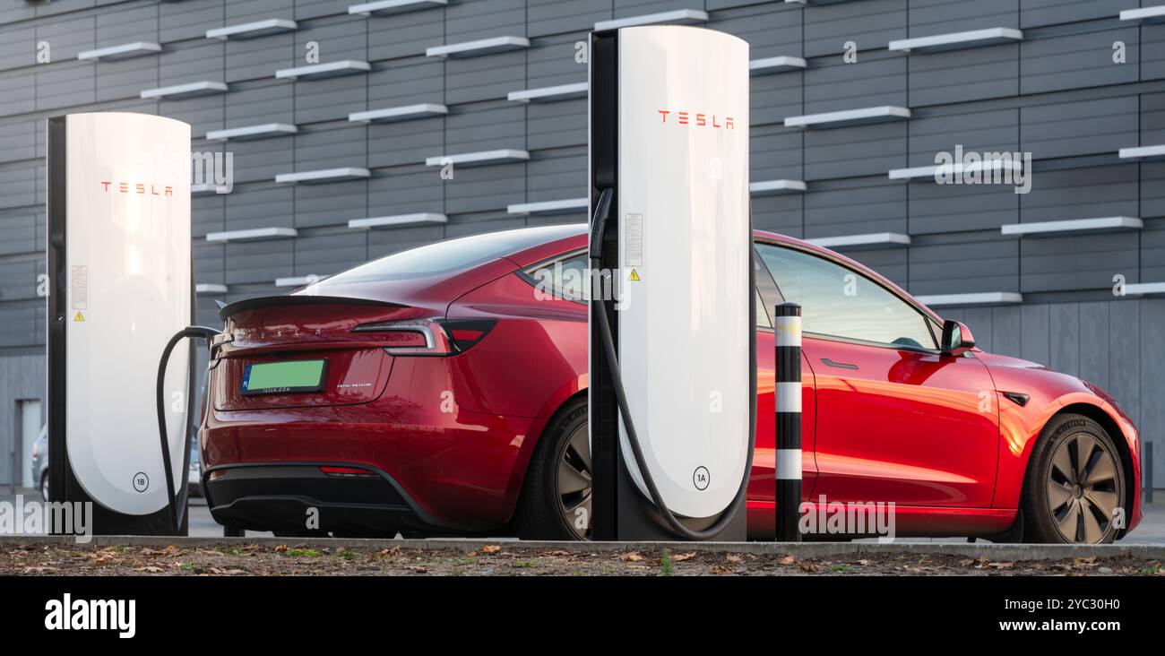Tesla Model 3 on Tesla charging station equipped with the latest ...