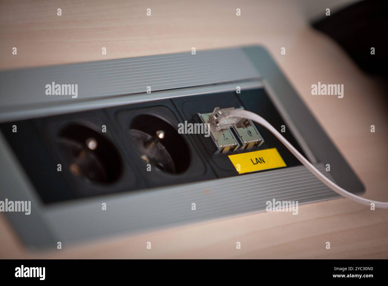 A sleek and modern power outlet designed with a network connection to ...