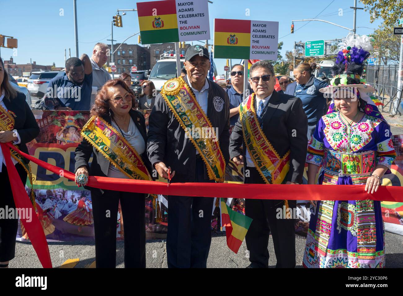 New York City Mayor Eric Adams (center) cuts a ribbon during the Queens ...