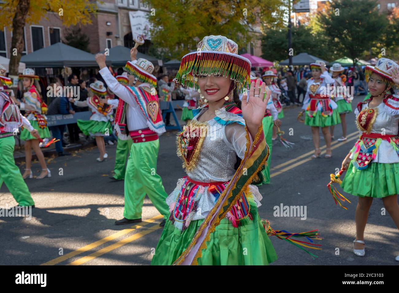 Participants in colorful costumes perform during the Queens Bolivian ...