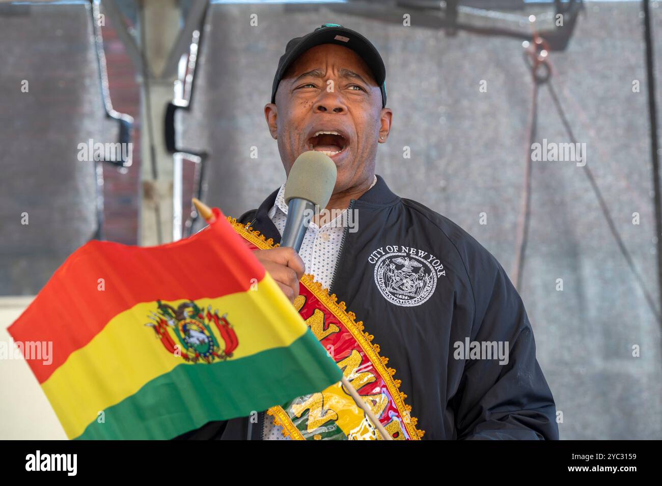 New York City Mayor Eric Adams speaks during the Queens Bolivian Parade ...