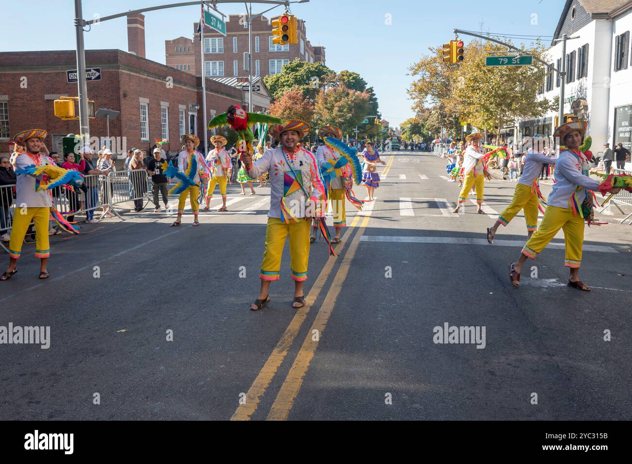 Participants in colorful costumes perform during the Queens Bolivian ...